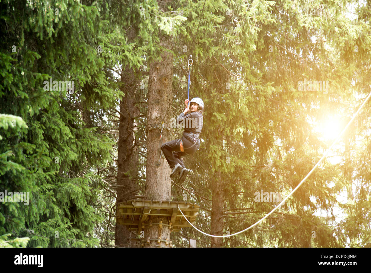 Person on zip wire line hi-res stock photography and images - Alamy