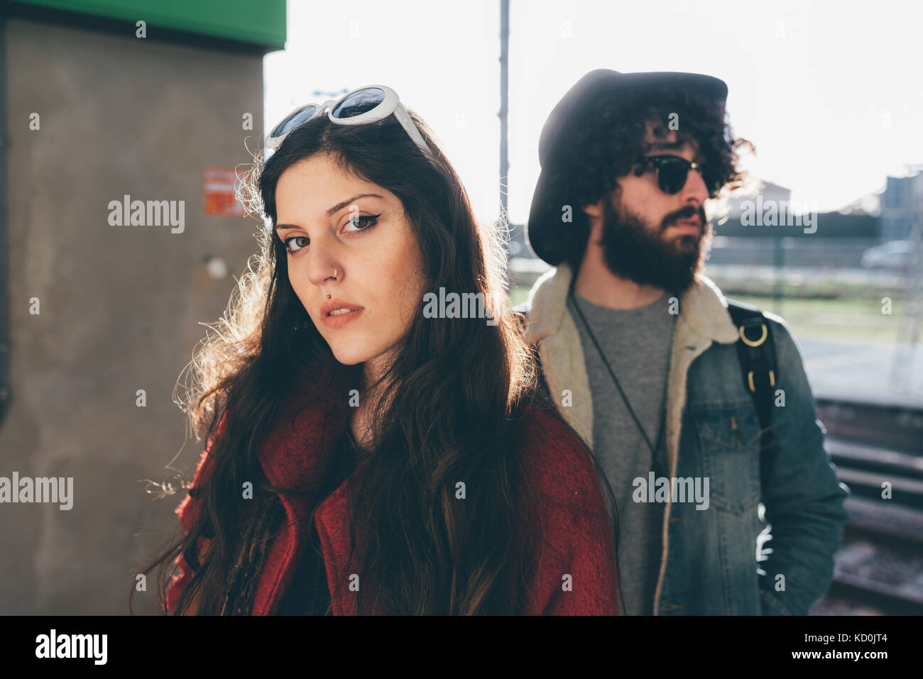 Portrait of young couple on train platform Stock Photo - Alamy