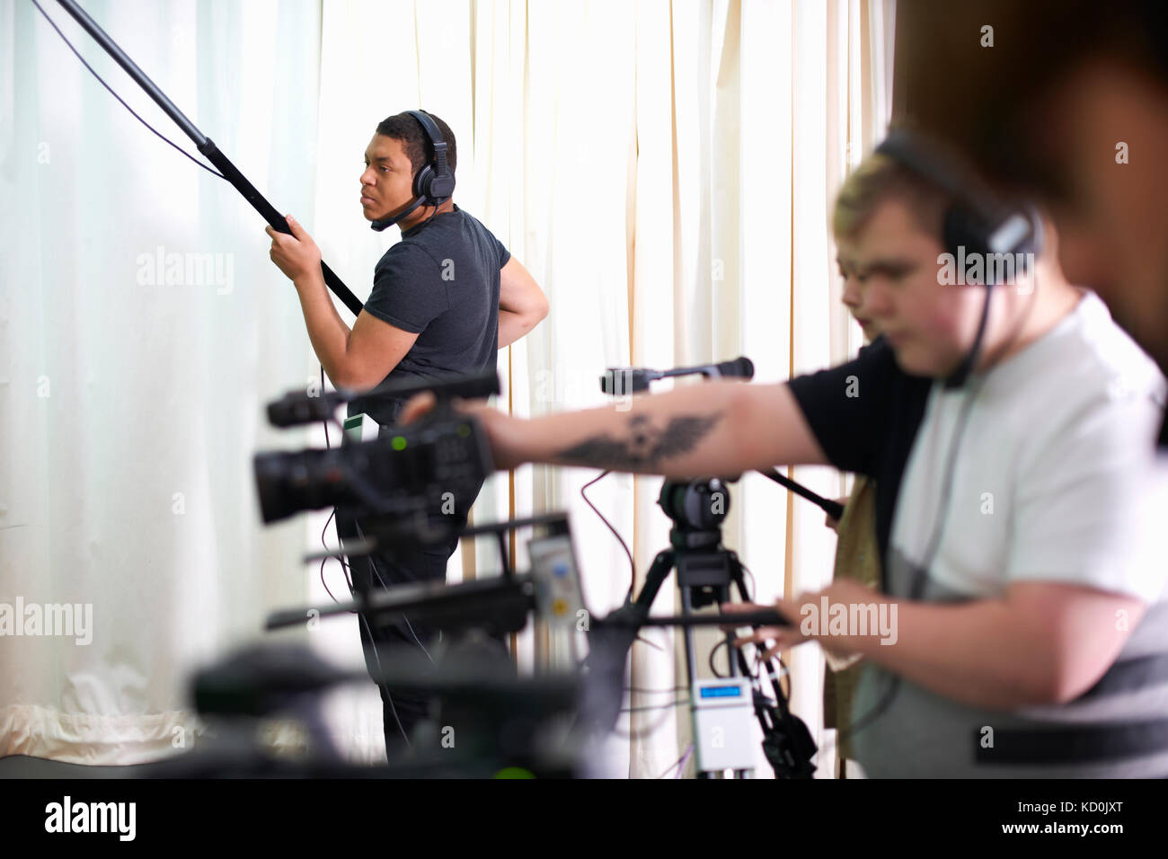 College students filming and recording in TV studio Stock Photo - Alamy