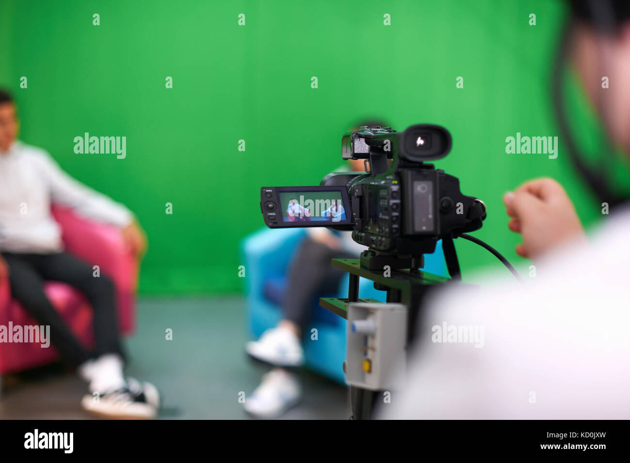 Young male and female college students practicing in TV studio with ...