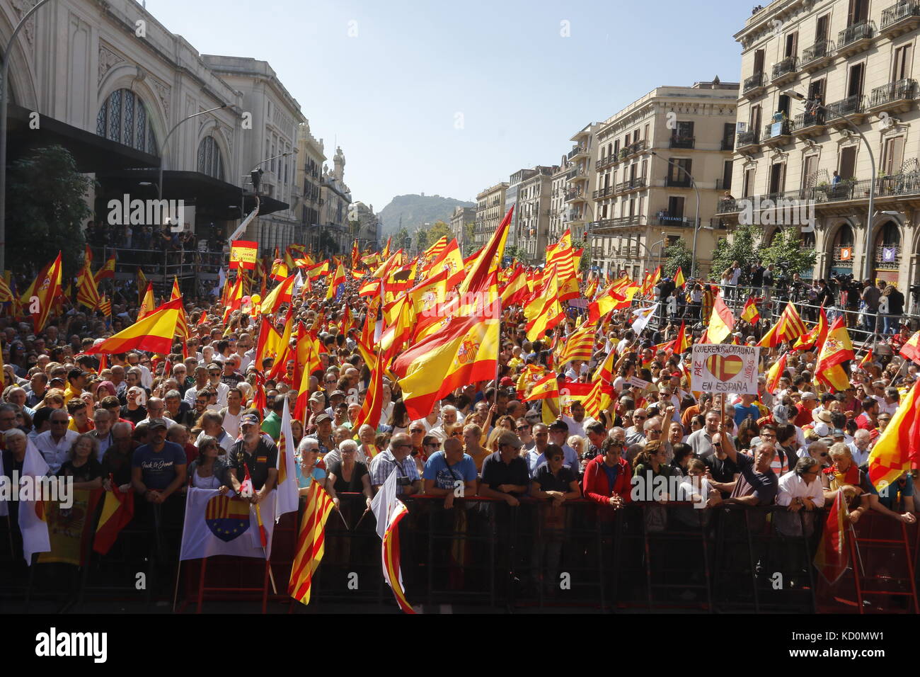 Demonstrators holding mostly Spanish flags march to protest the Catalan ...