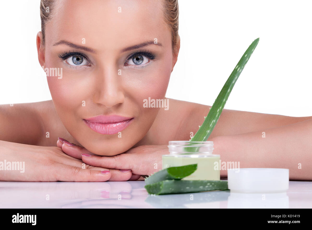 Beautiful woman with healthy skin posing next cream of aloe vera Stock ...