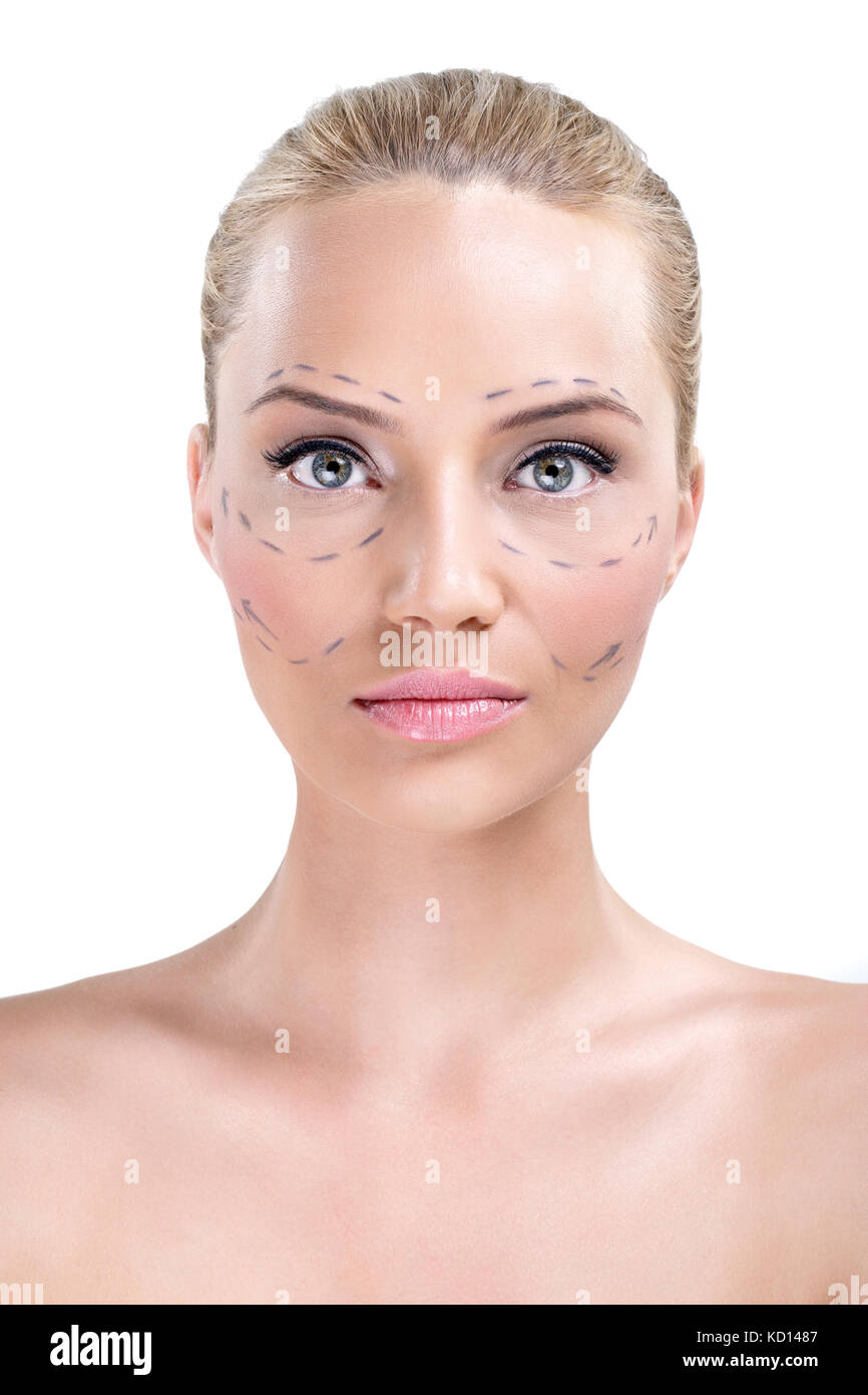 Portrait of a pretty woman's face marked with lines for facial cosmetic ...