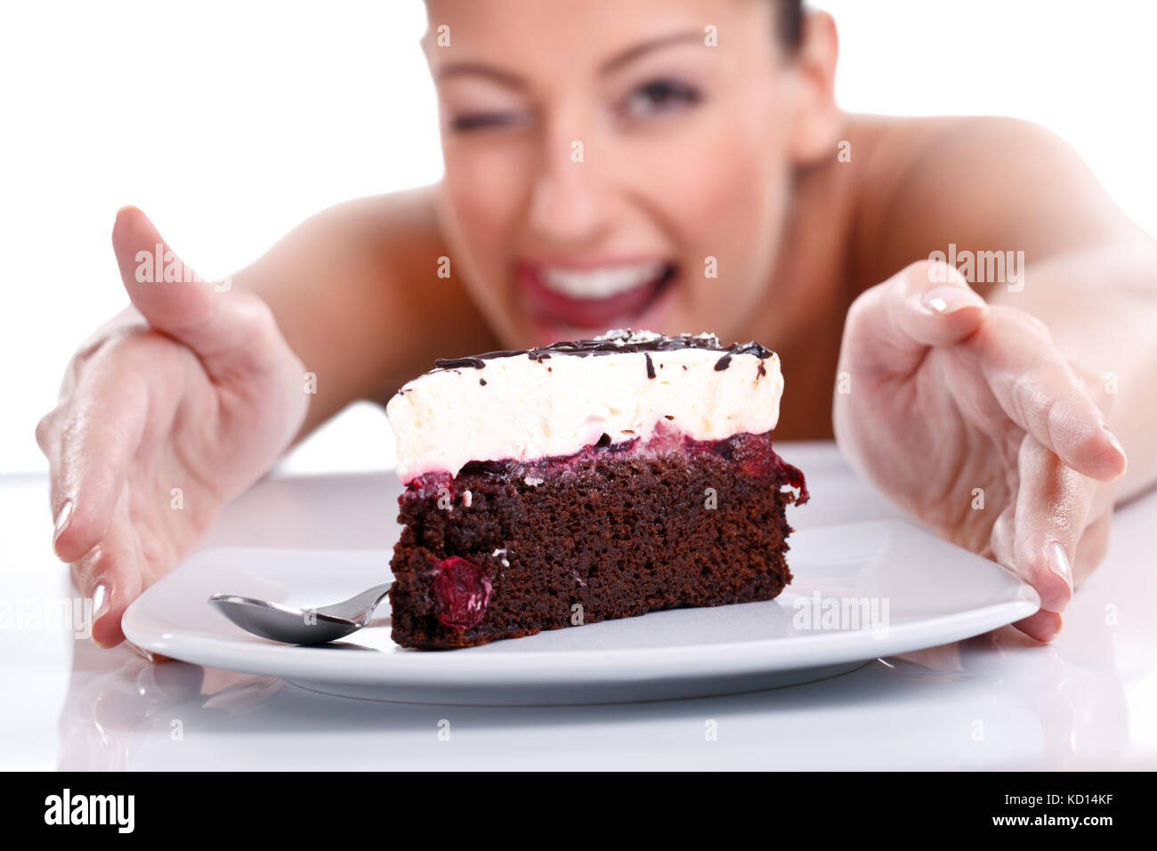 girl takes a piece of cake Stock Photo - Alamy