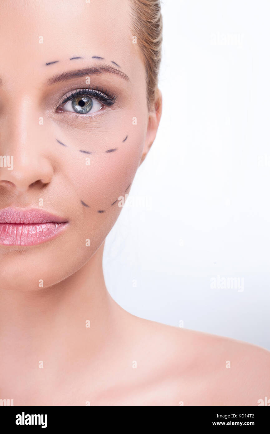 Lines on an attractive Caucasian lady face as marks for cosmetic ...