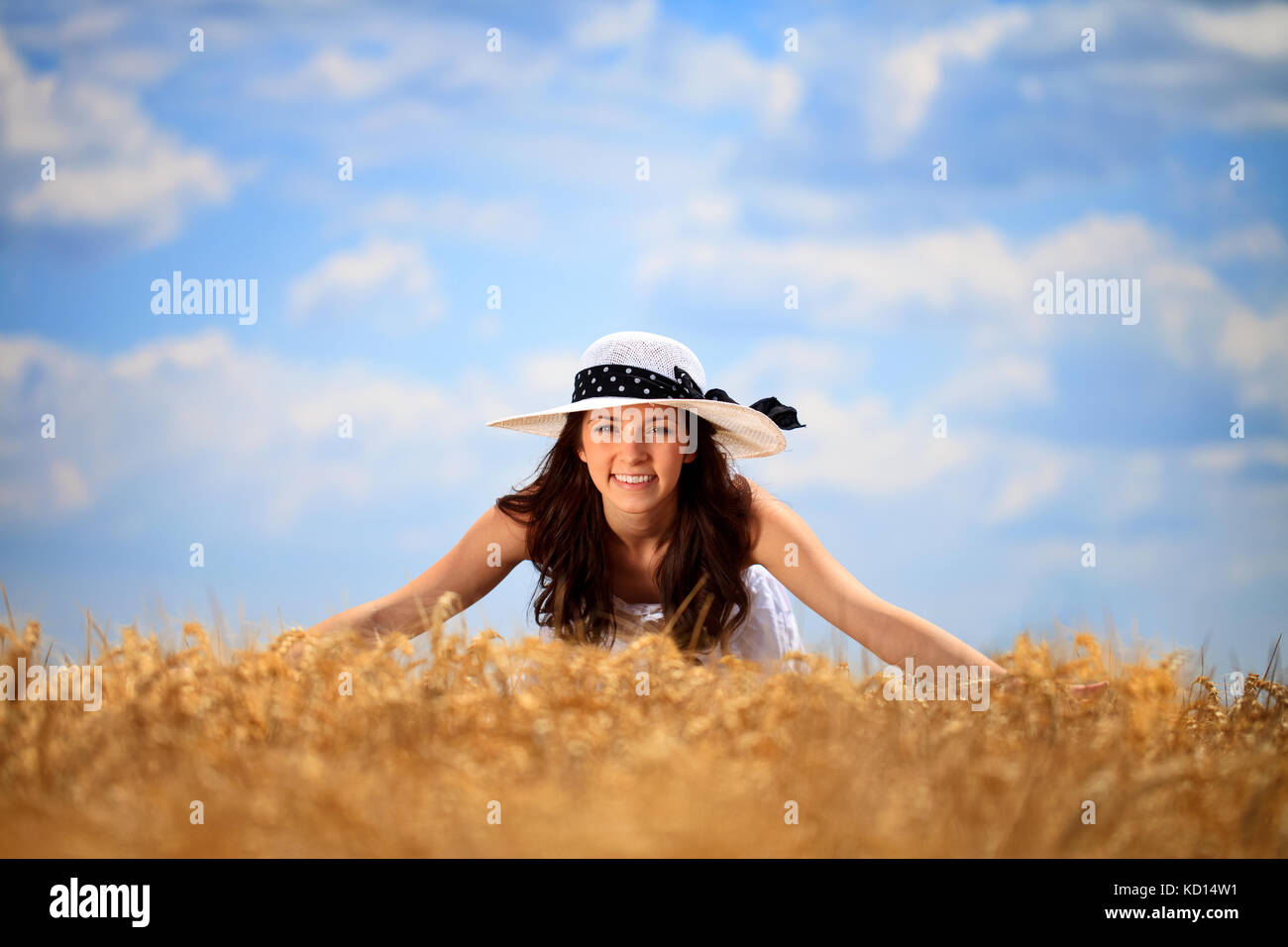 Young happy girl in wheat field Stock Photo - Alamy