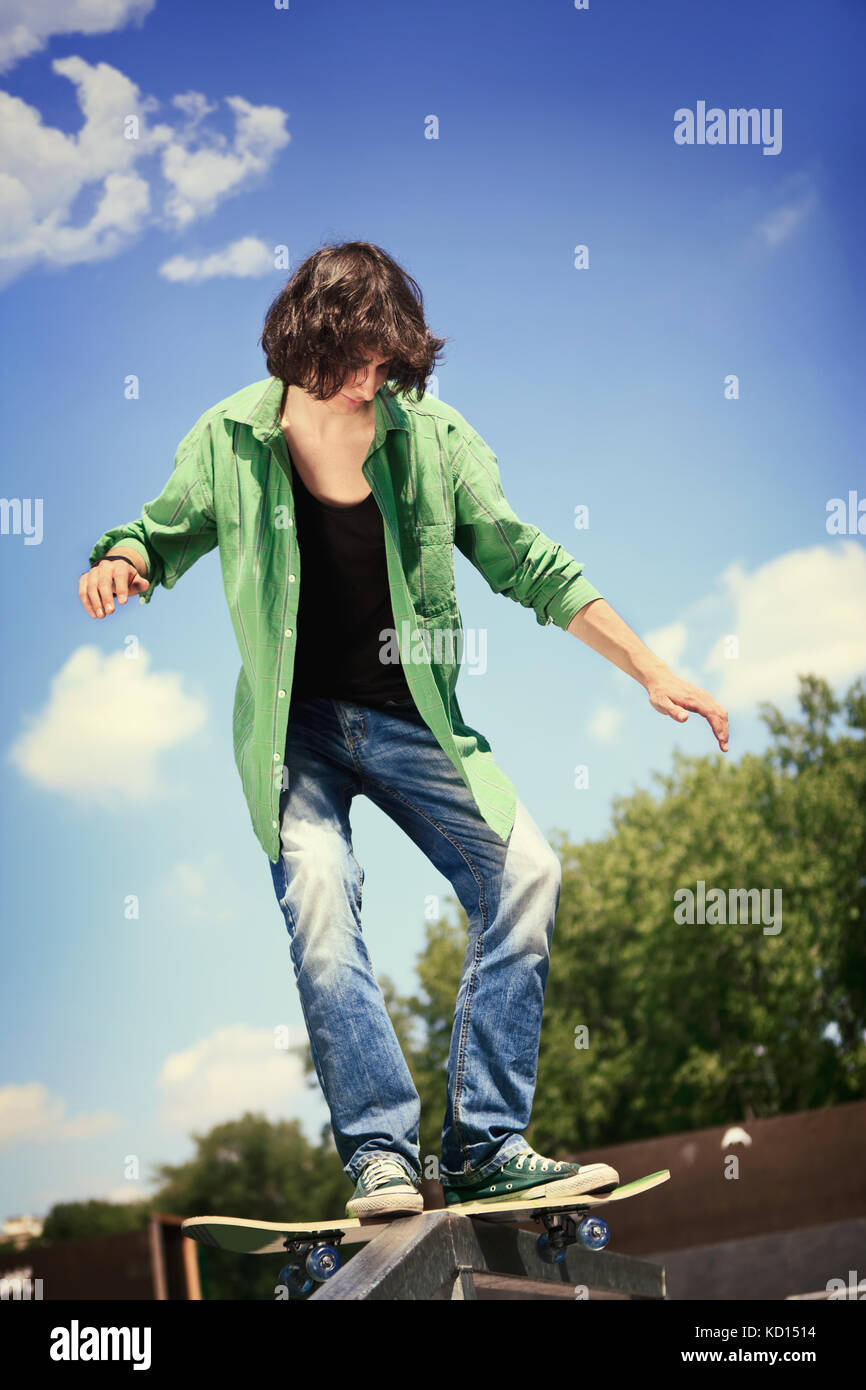 boy having fun skateboarding at a skate park Stock Photo - Alamy