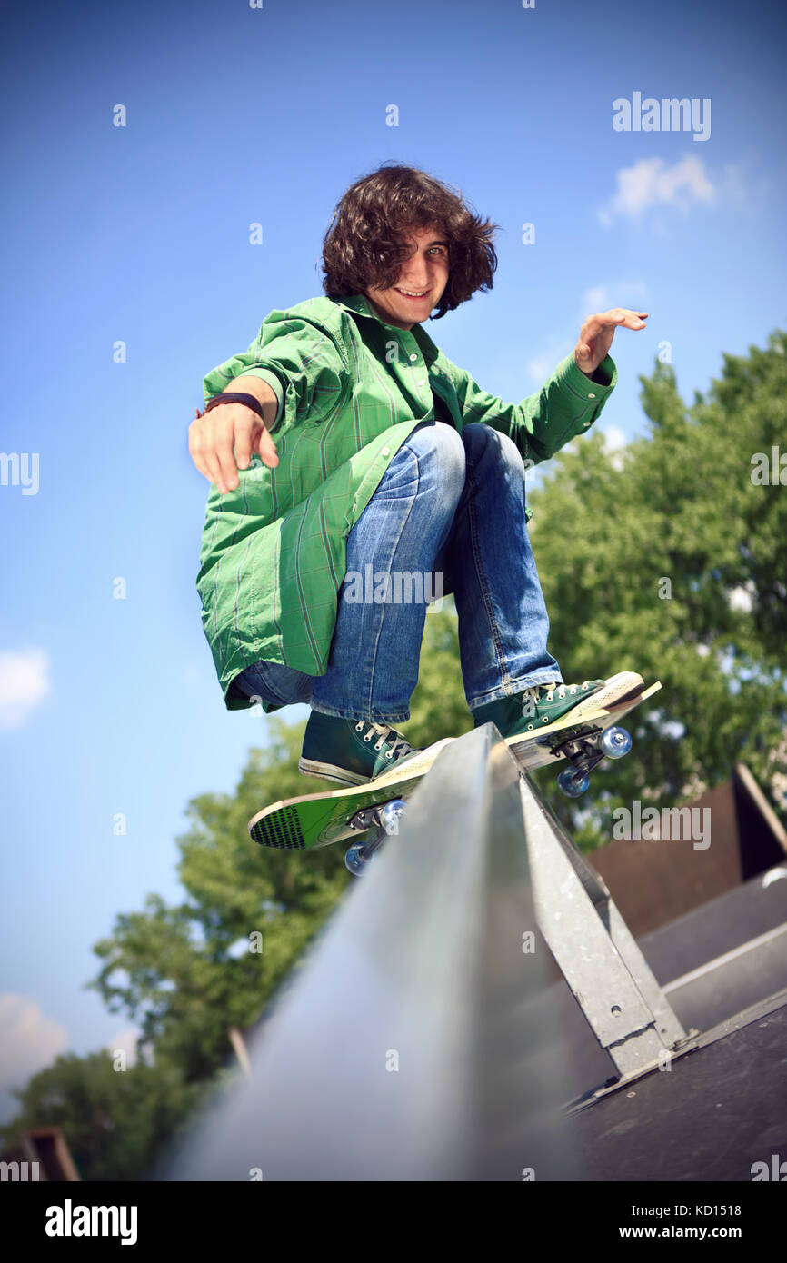 Boy practicing skate in a skate park Stock Photo - Alamy