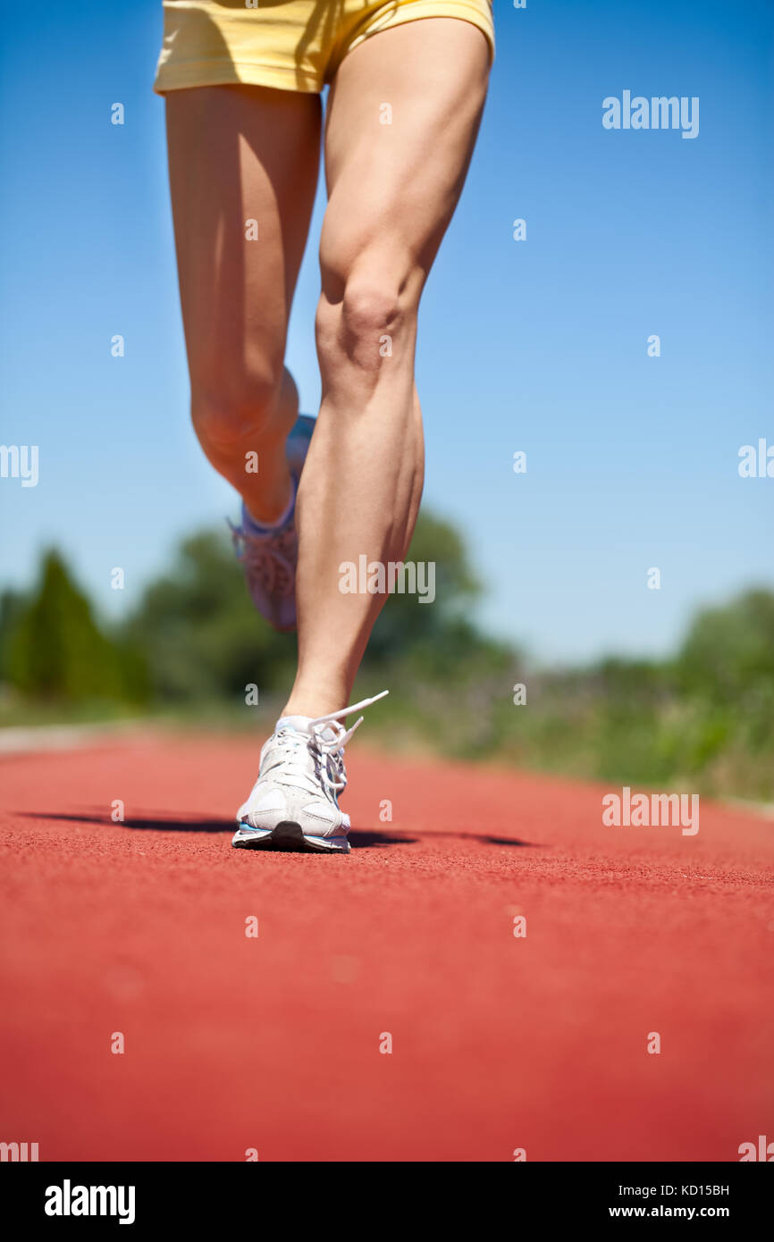 Running legs and shoes of runner in action Stock Photo - Alamy