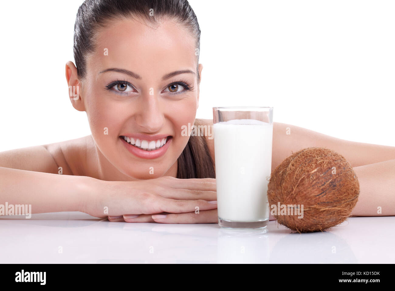 Smiling beautiful woman with coconut milk Stock Photo - Alamy