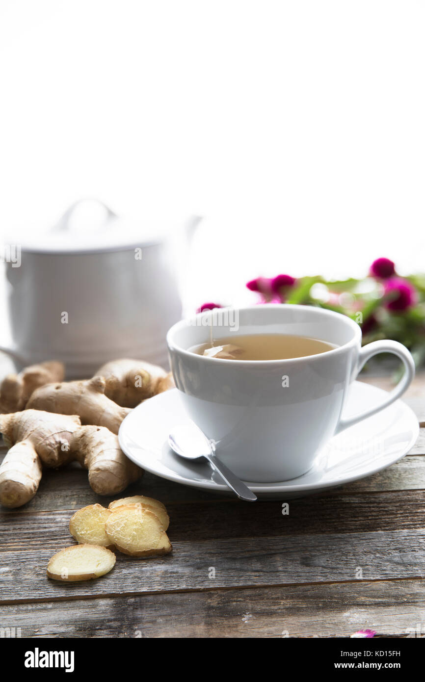 Ginger tea with ginger roots and slices on table Stock Photo - Alamy