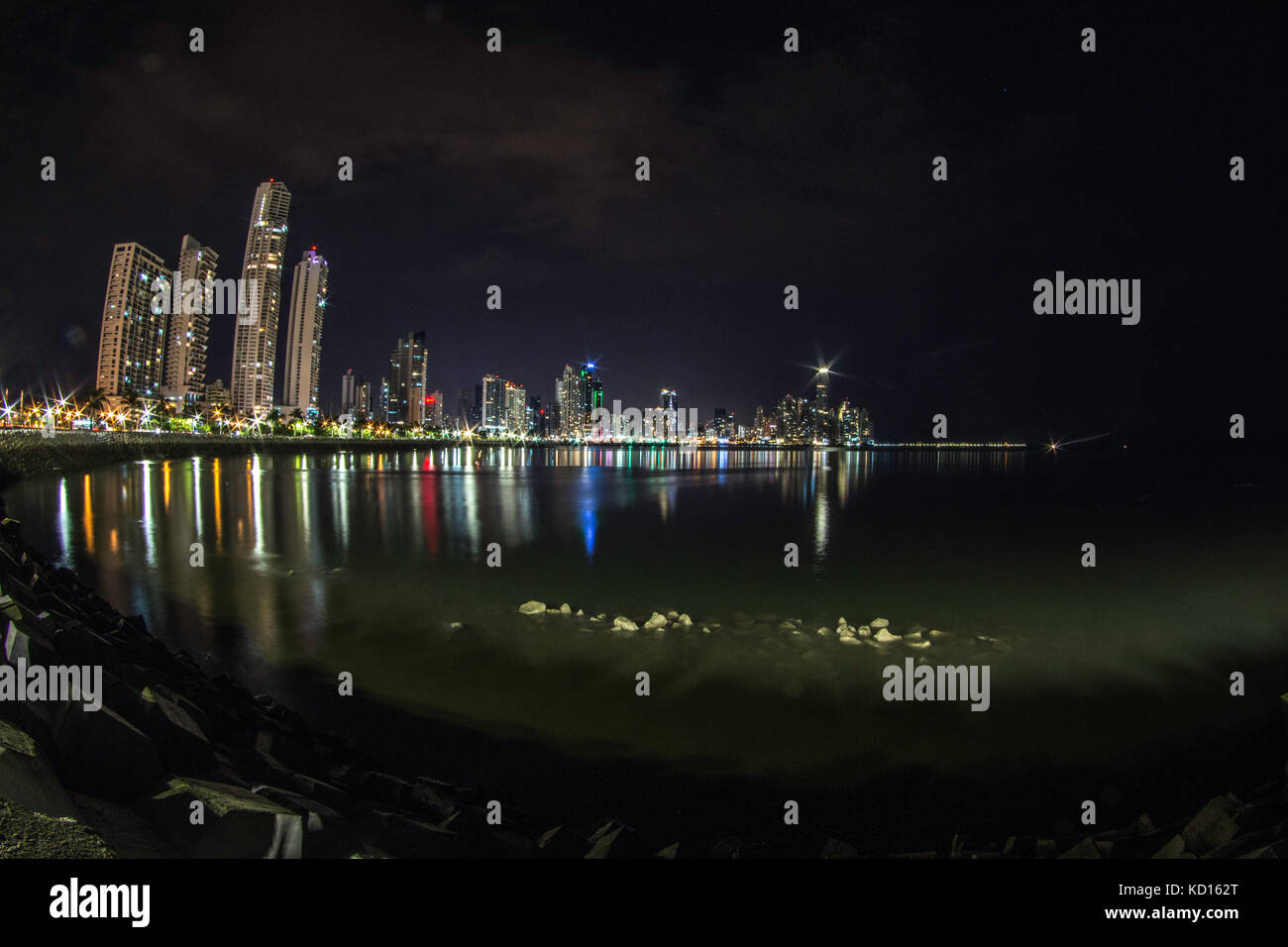 The blue light of dusk illuminates a block of high rises over the ...