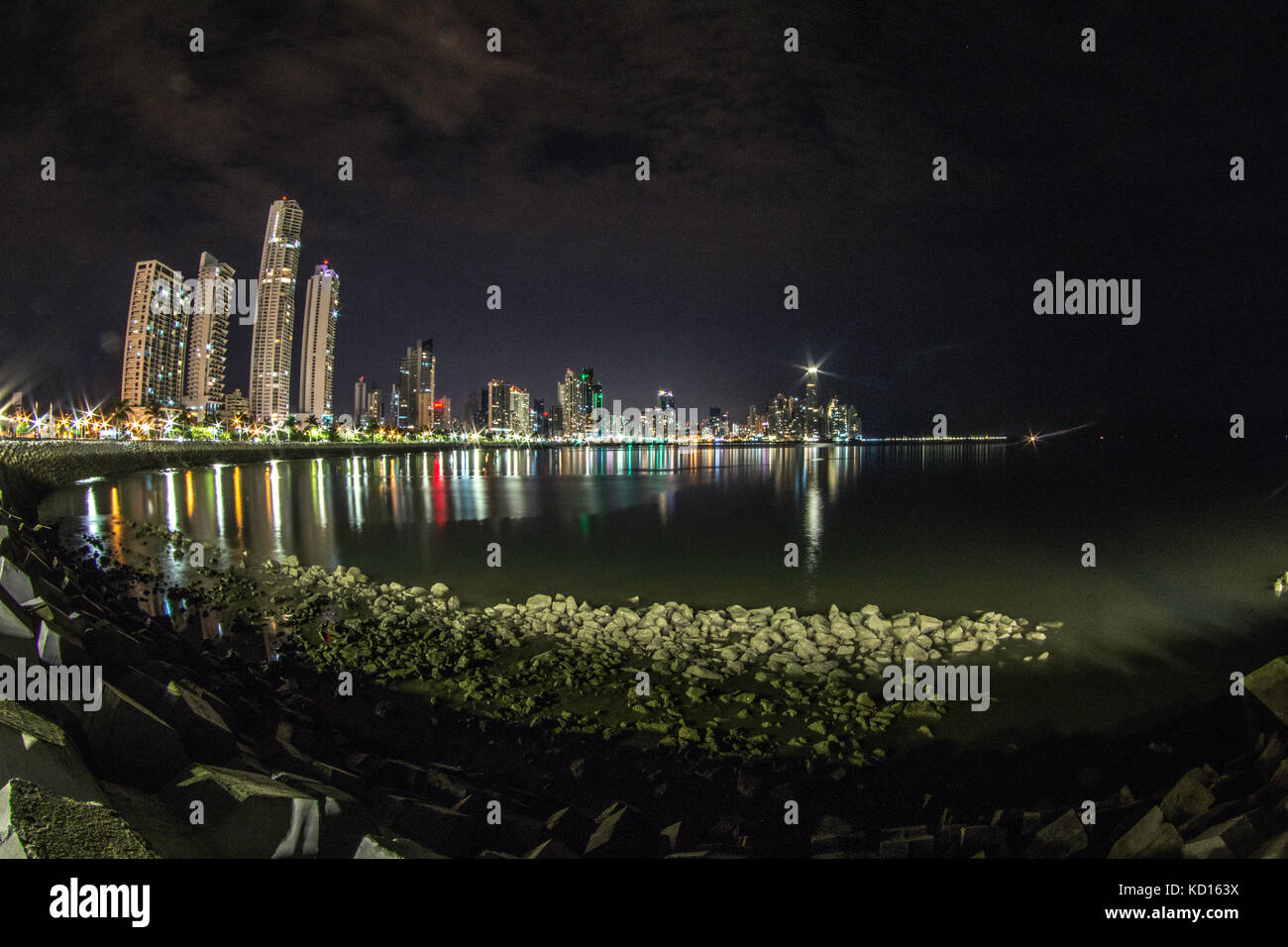 The blue light of dusk illuminates a block of high rises over the ...