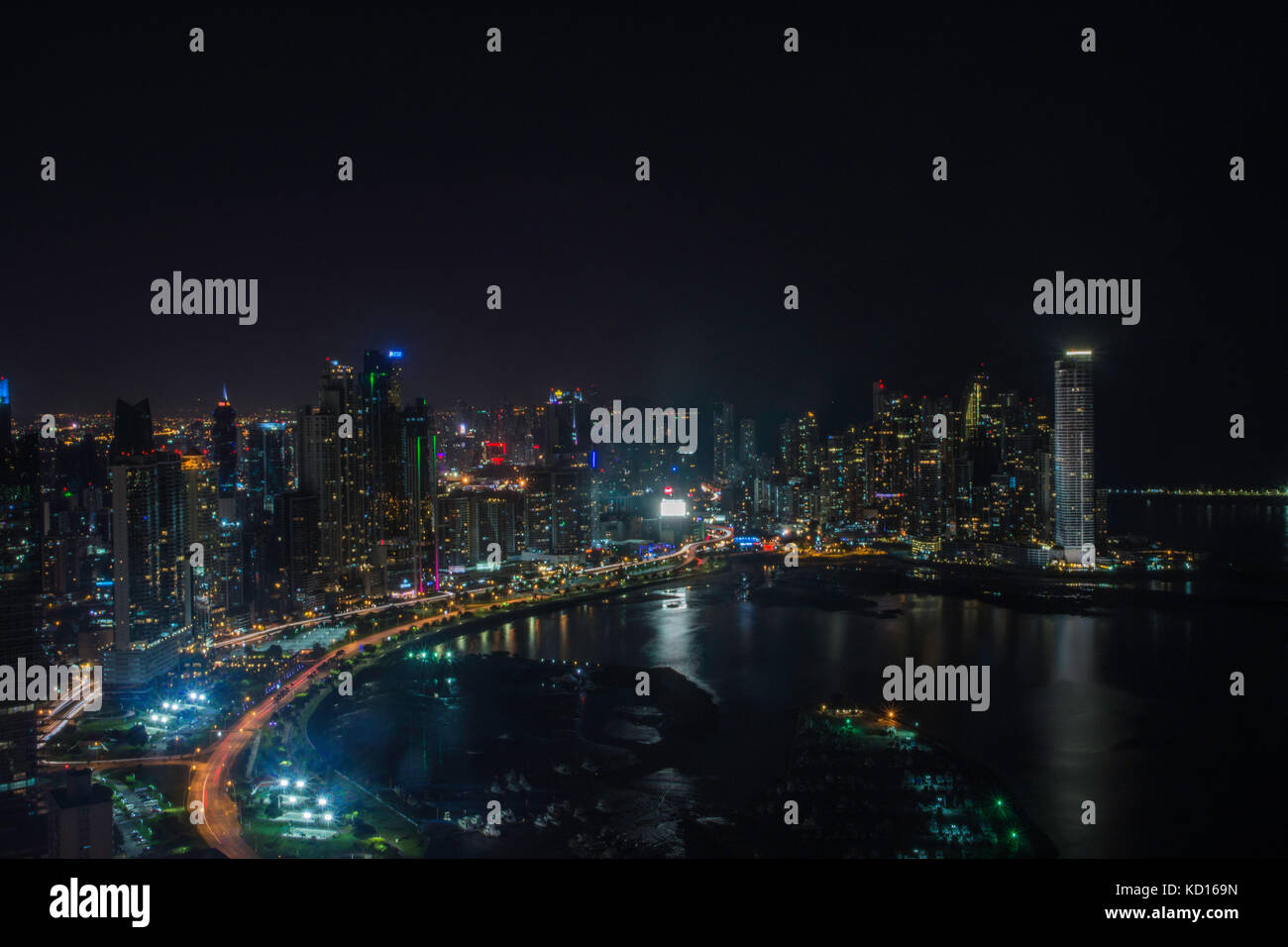 The blue light of dusk illuminates a block of high rises over the ...
