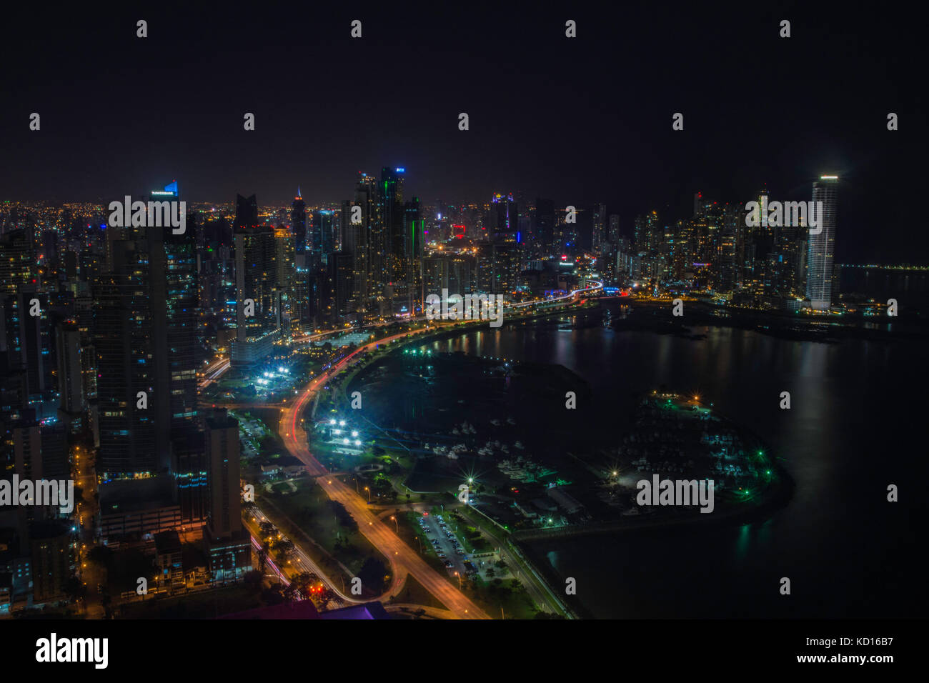 The blue light of dusk illuminates a block of high rises over the ...