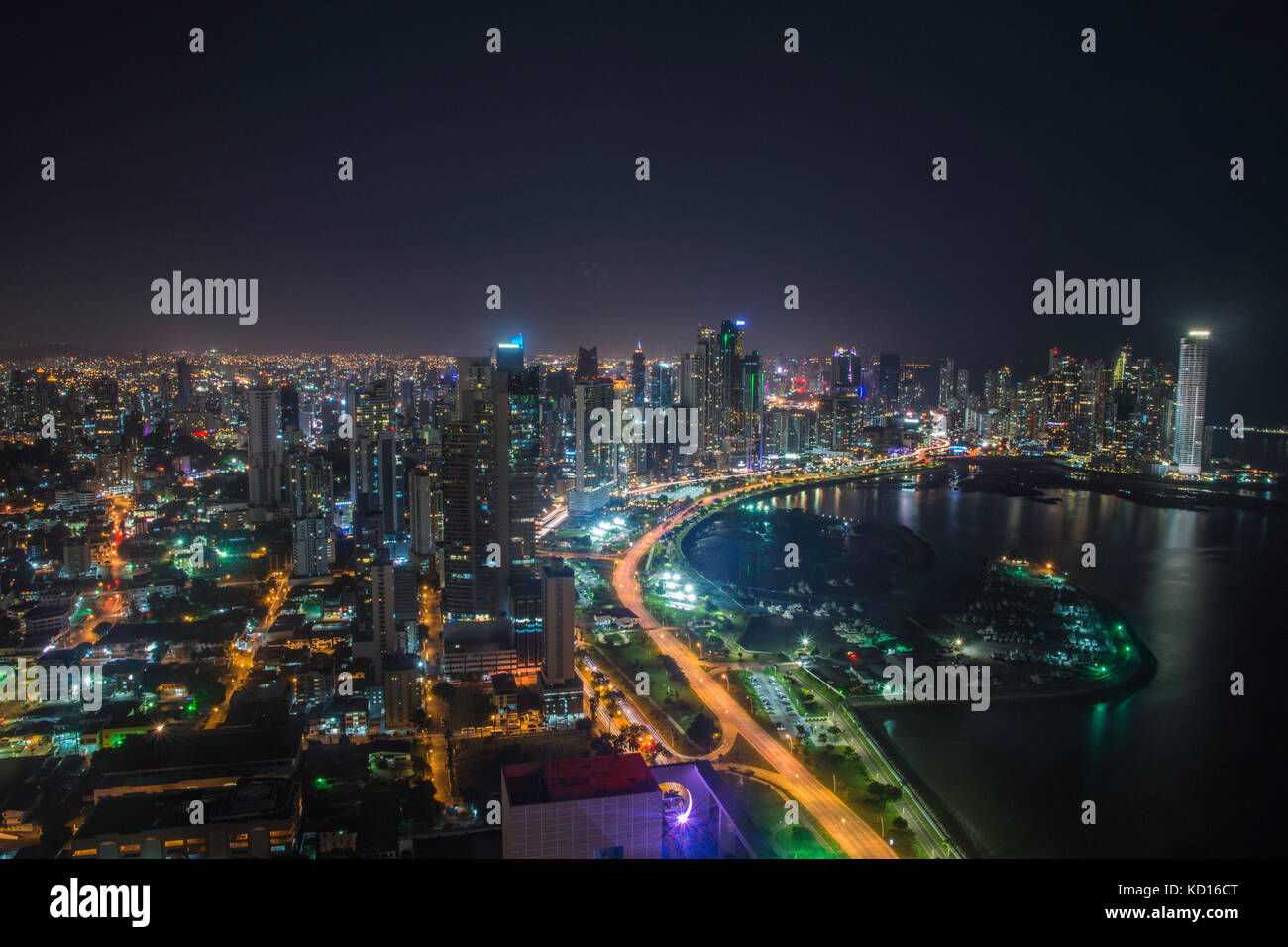 The blue light of dusk illuminates a block of high rises over the ...