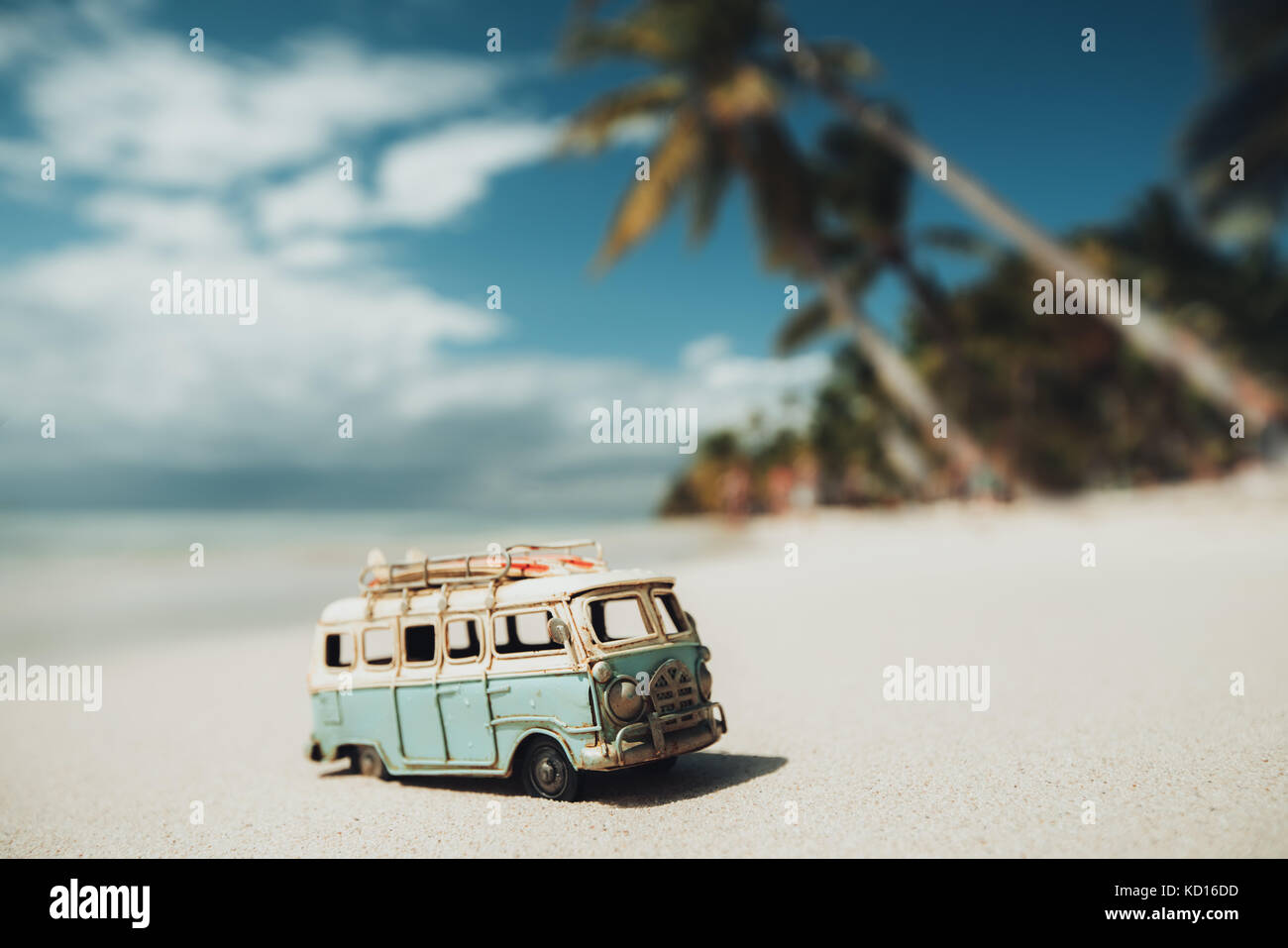 Vintage miniature van on the tropical beach at sunrise, travel concept ...