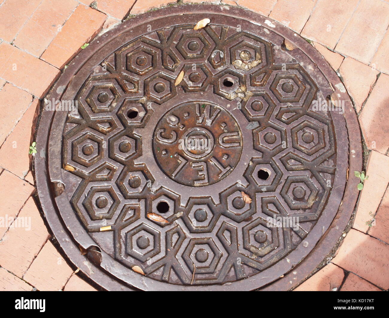 Telephone company manhole cover Stock Photo - Alamy