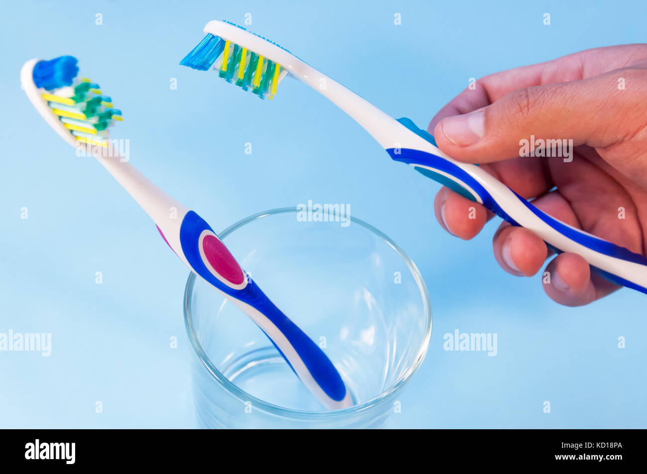 Toothpaste brush in mans hand hi-res stock photography and images - Alamy