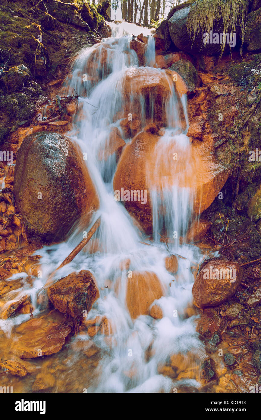 Red rocks waterfall in Latvia, Vaive. 2011 Stock Photo - Alamy