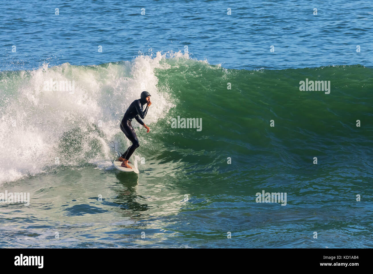 A surfer is surfing on a wave at San Francisco Bay, California Stock ...