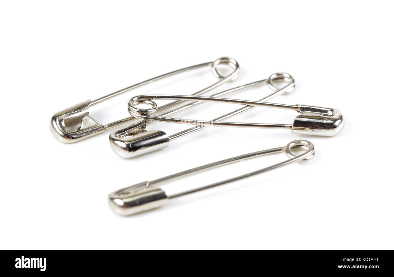 Metal safety pin on white background Stock Photo - Alamy