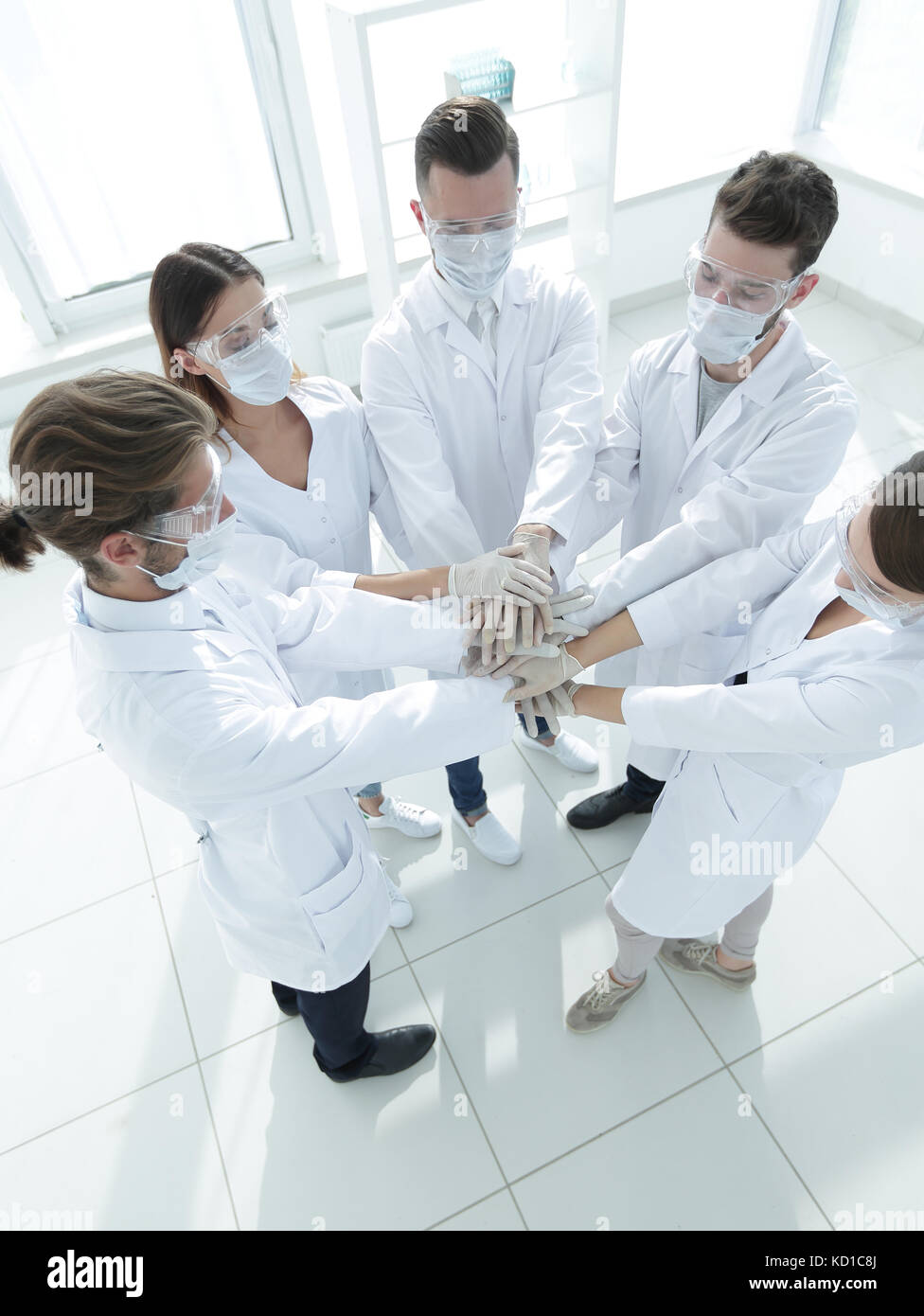 Health care workers demonstrating unity Stock Photo - Alamy