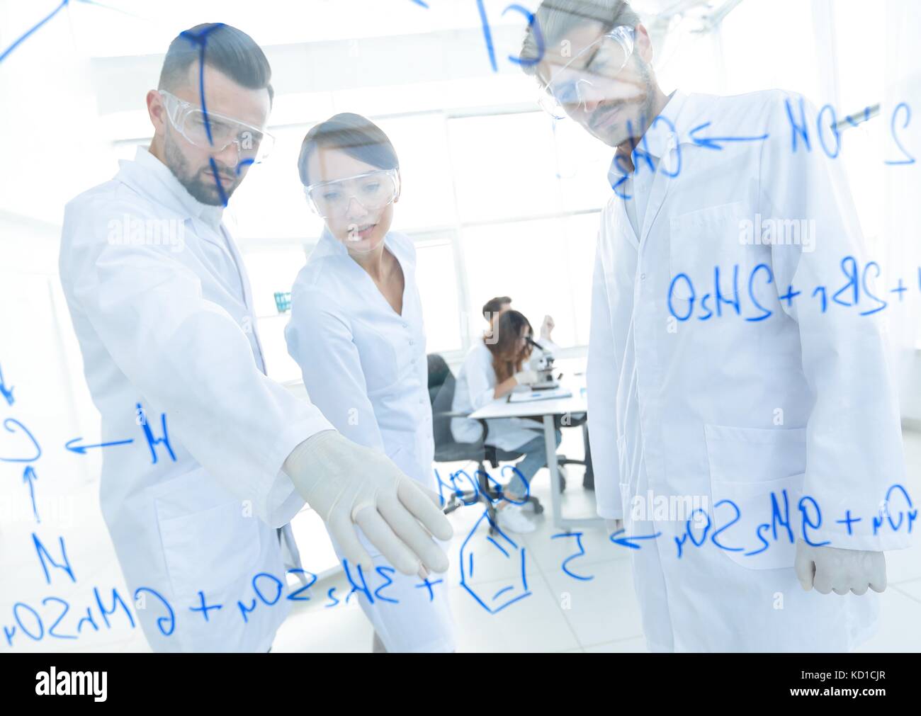 group of young scientists talking in a lab Stock Photo - Alamy