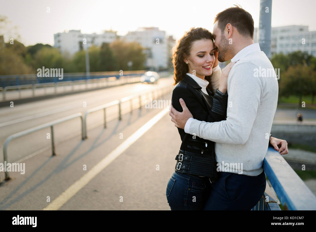 Couple cuddling while enjoying time spent together Stock Photo - Alamy