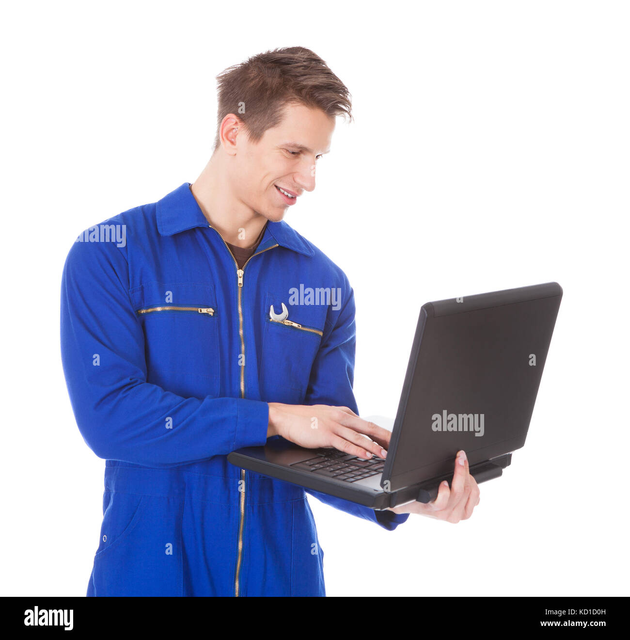 Young Male Technician Using Laptop Over White Background Stock Photo ...
