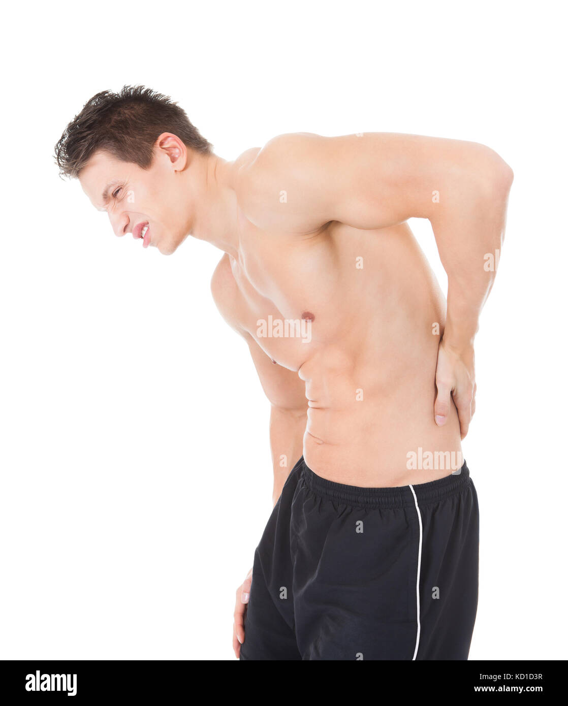 Portrait Of A Young Man Suffering From Back Pain Stock Photo - Alamy