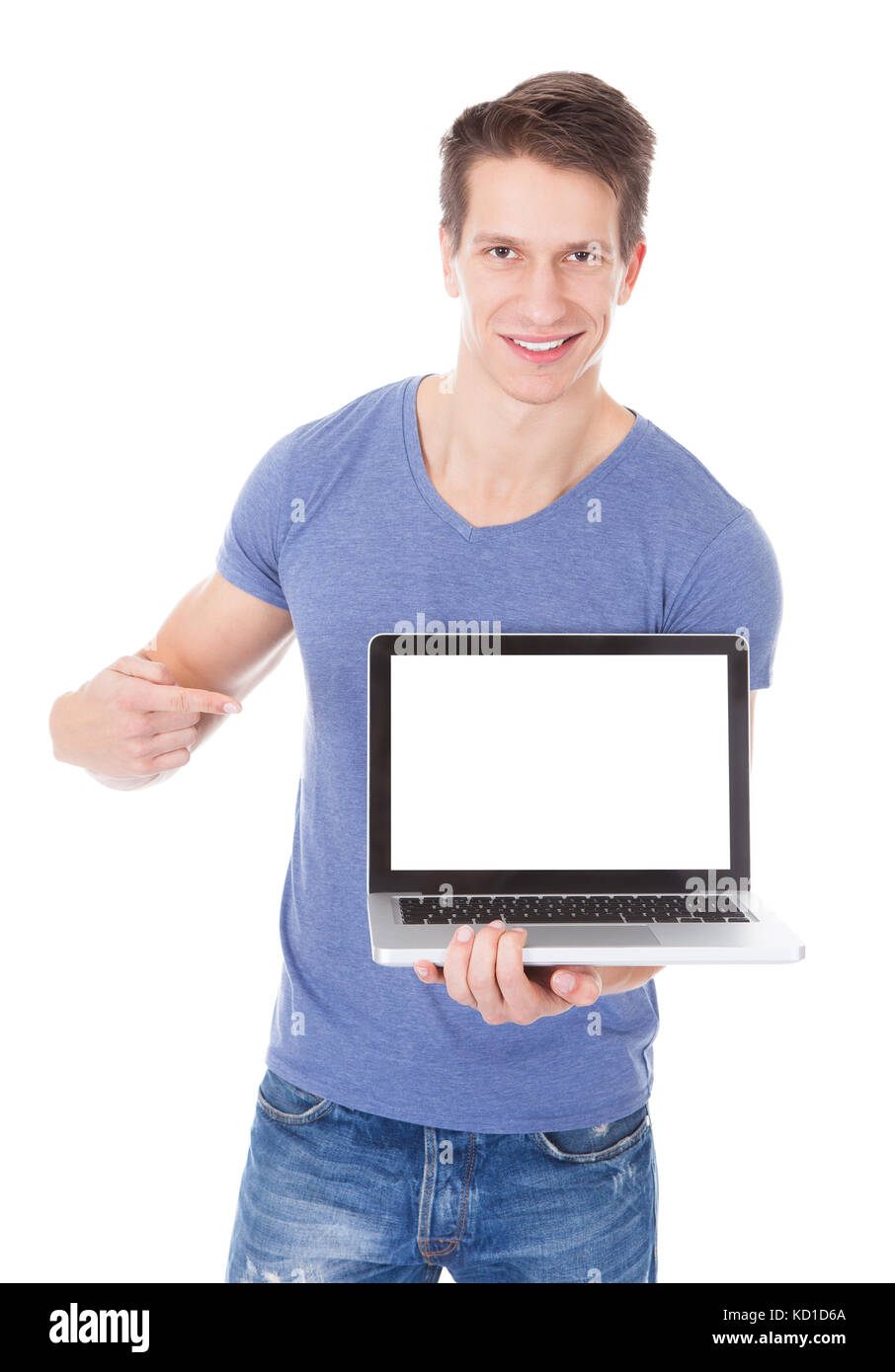 Happy man holding laptop pointing hi-res stock photography and images ...