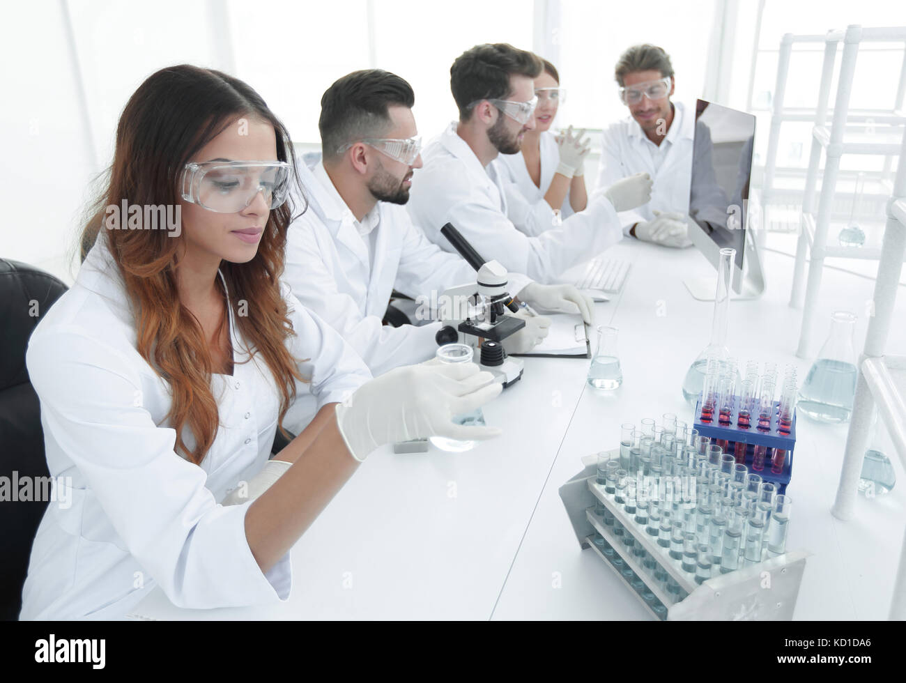 group of young scientists working in the laboratory Stock Photo - Alamy