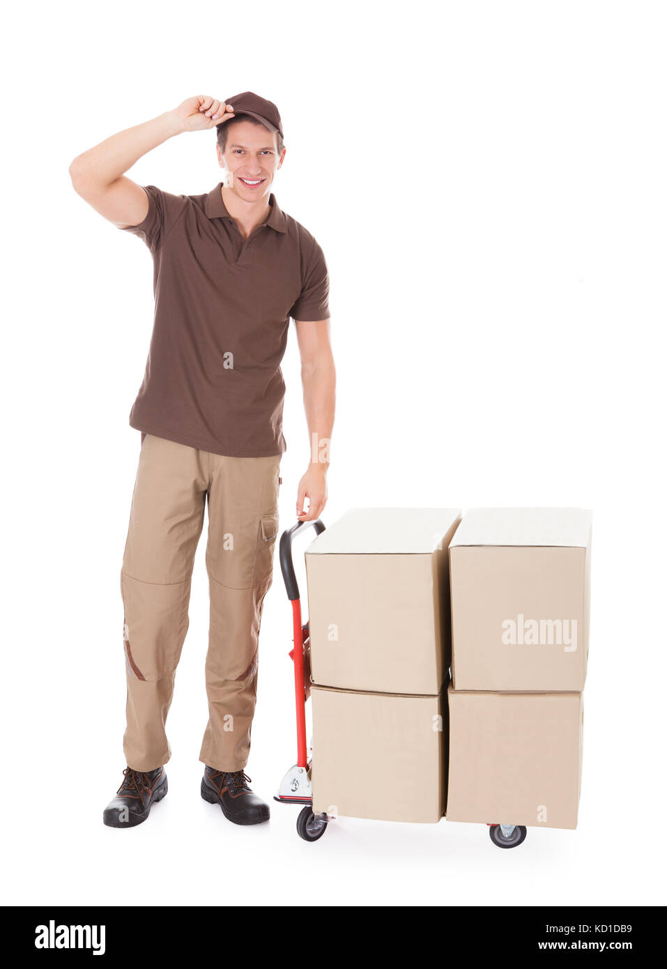 Happy Delivery Man Standing With Boxes On Hand truck Over White ...