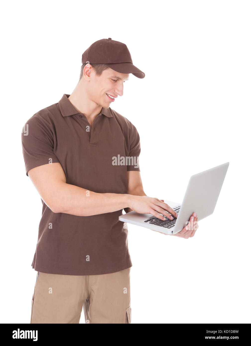 Young Delivery Man Using Laptop Over White Background Stock Photo - Alamy