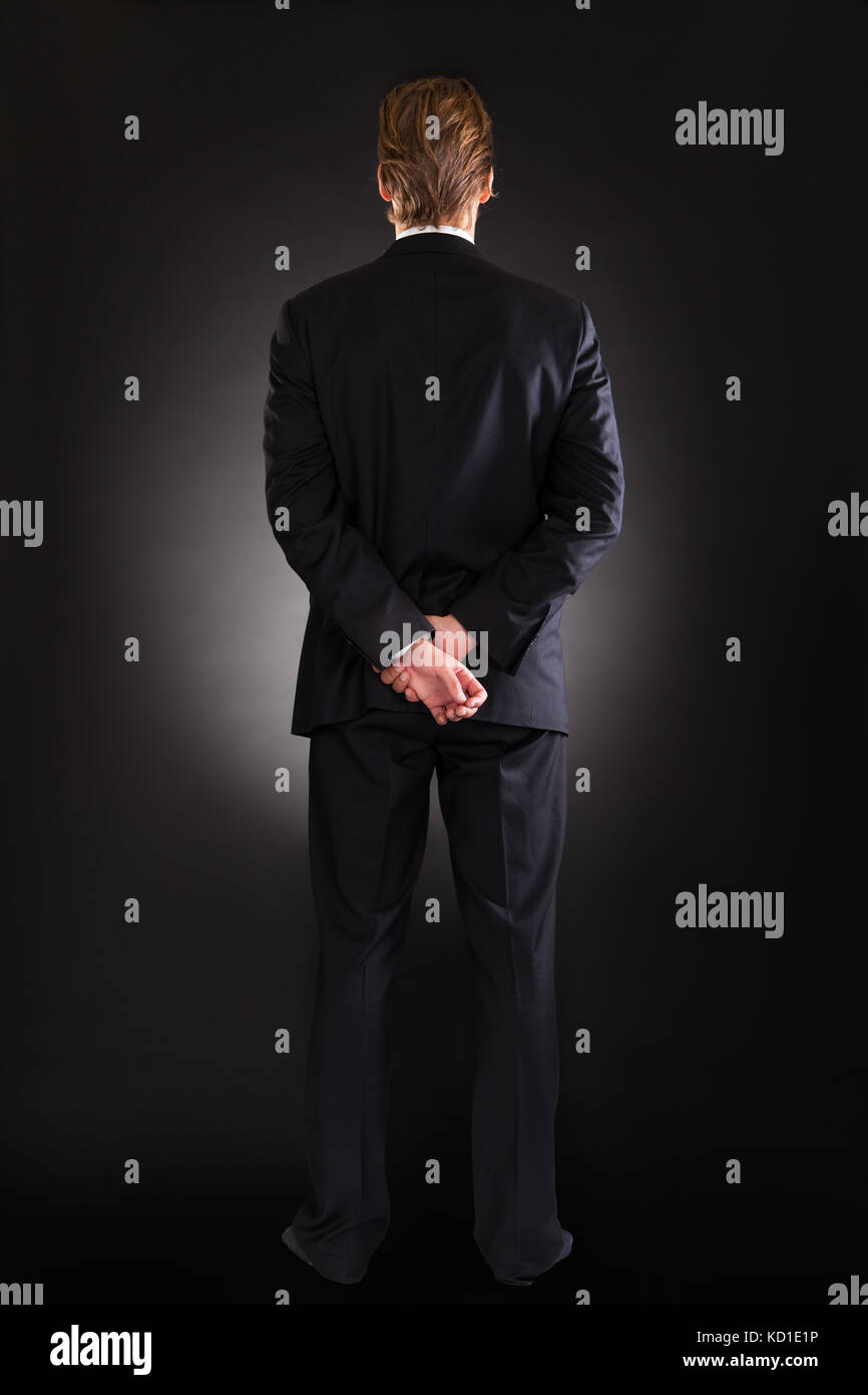 Man hands behind back rear view hi-res stock photography and images - Alamy