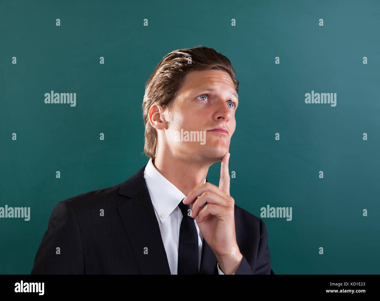 Portrait Of Young Thoughtful Businessman Looking Up Stock Photo - Alamy Portrait Of Young Thoughtful Businessman Looking Up Stock Photo - Alamy