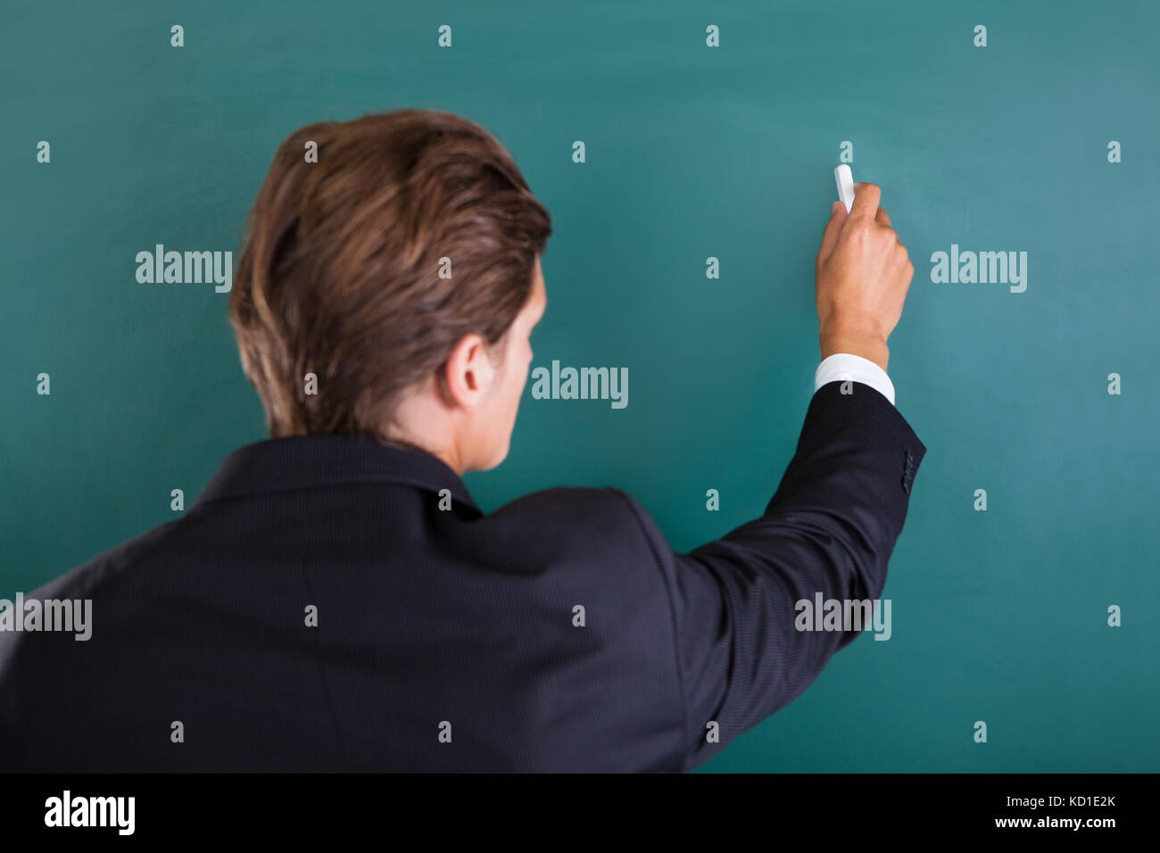 Close-up Of A Professor Writing On Chalkboard Stock Photo - Alamy