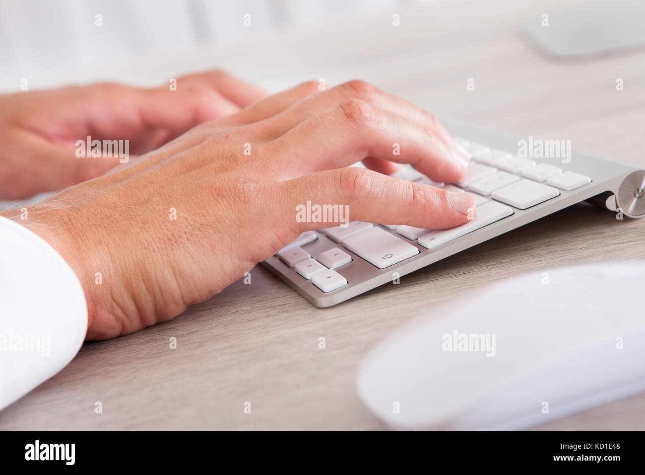 Closeup Of Businessman Using Computer At Desk Stock Photo - Alamy
