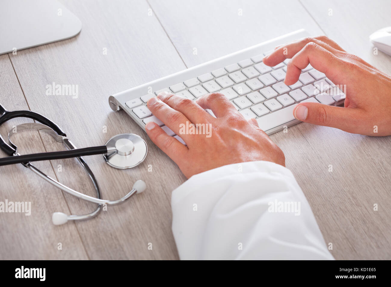 Close-up Of Male Doctor's Hand Typing On Computer Keyboard Stock Photo ...
