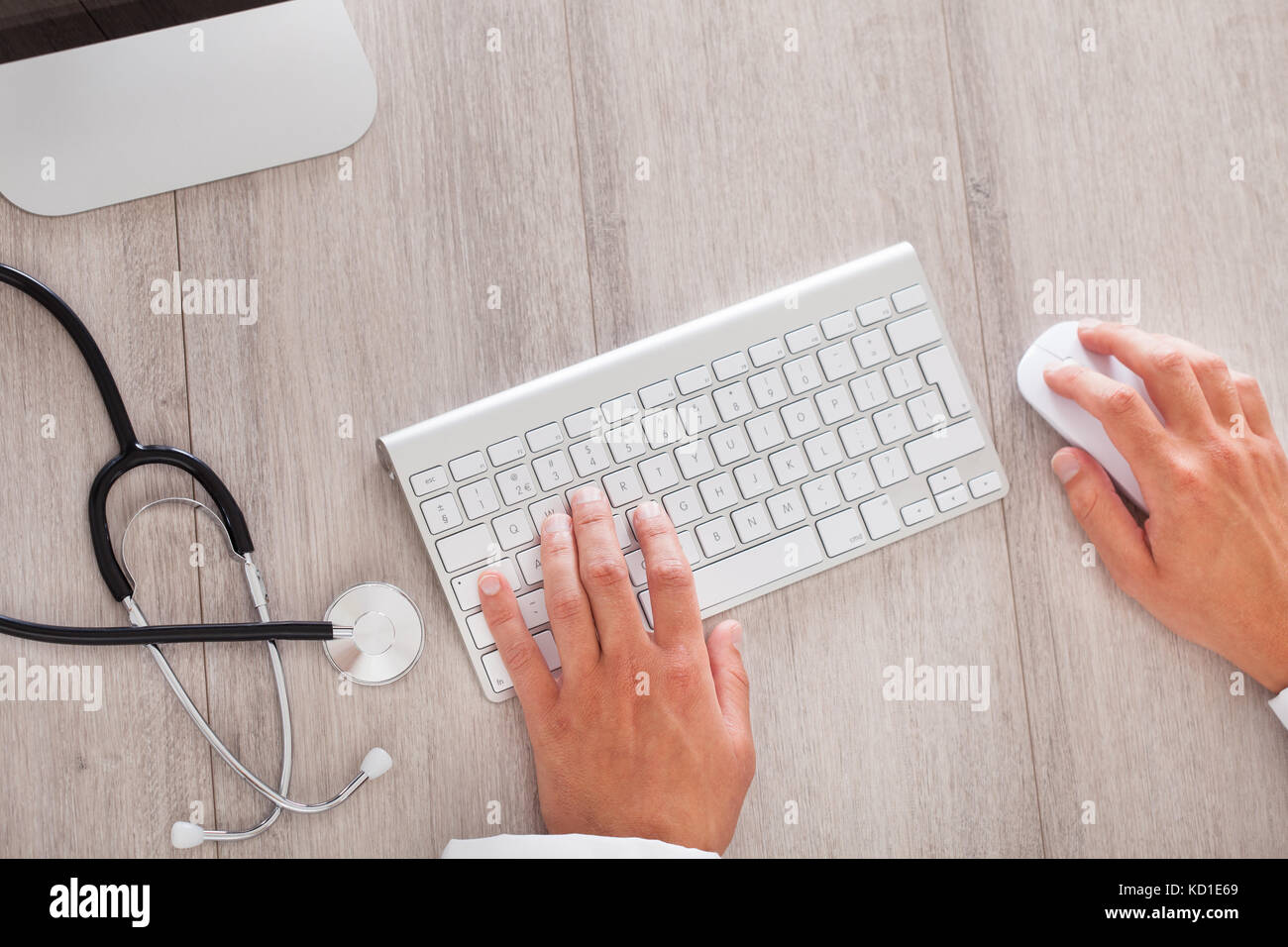 Close-up Of Male Doctor's Hand Typing On Computer Keyboard Stock Photo ...