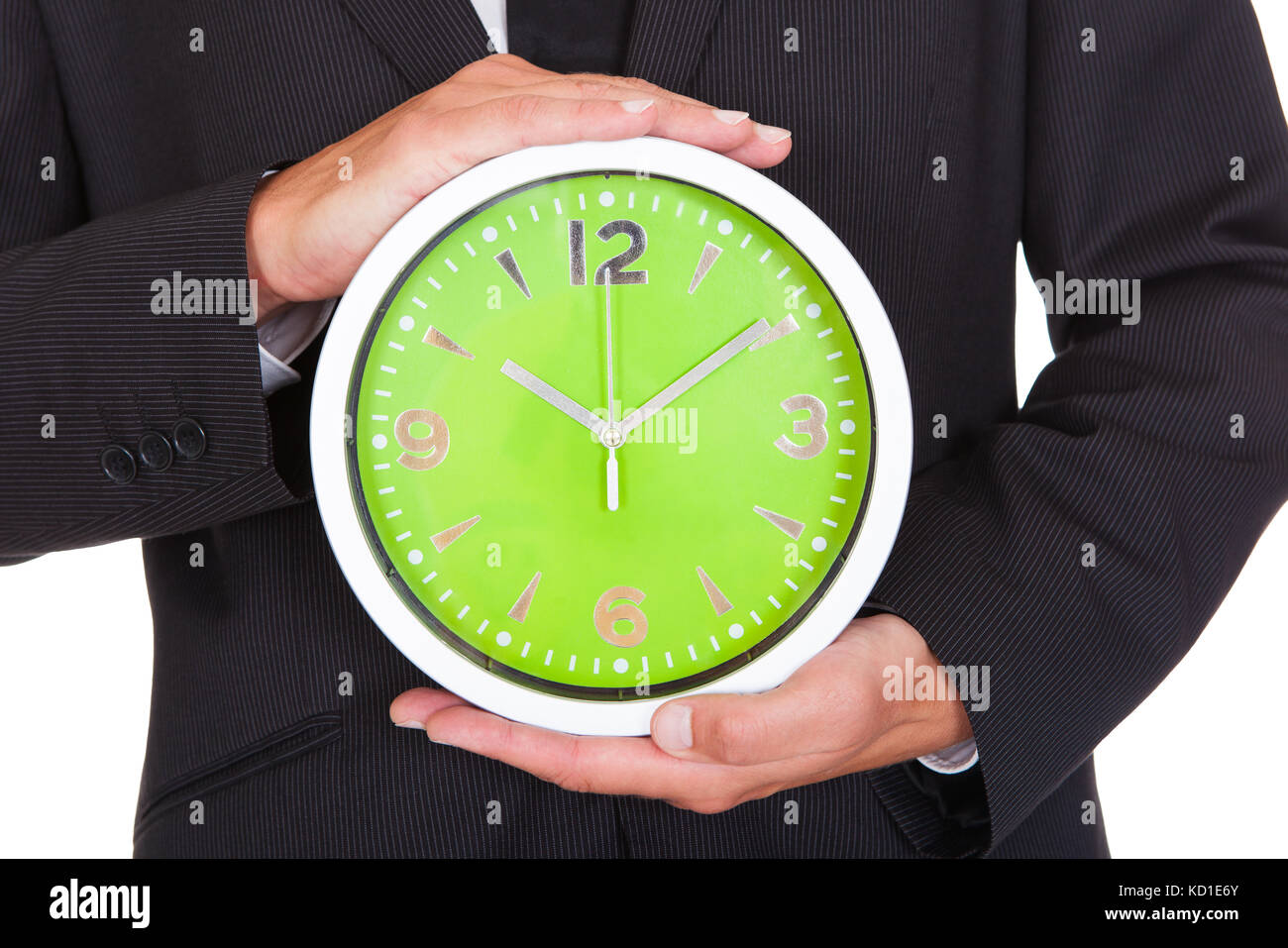 Hand holding clock hi-res stock photography and images - Alamy