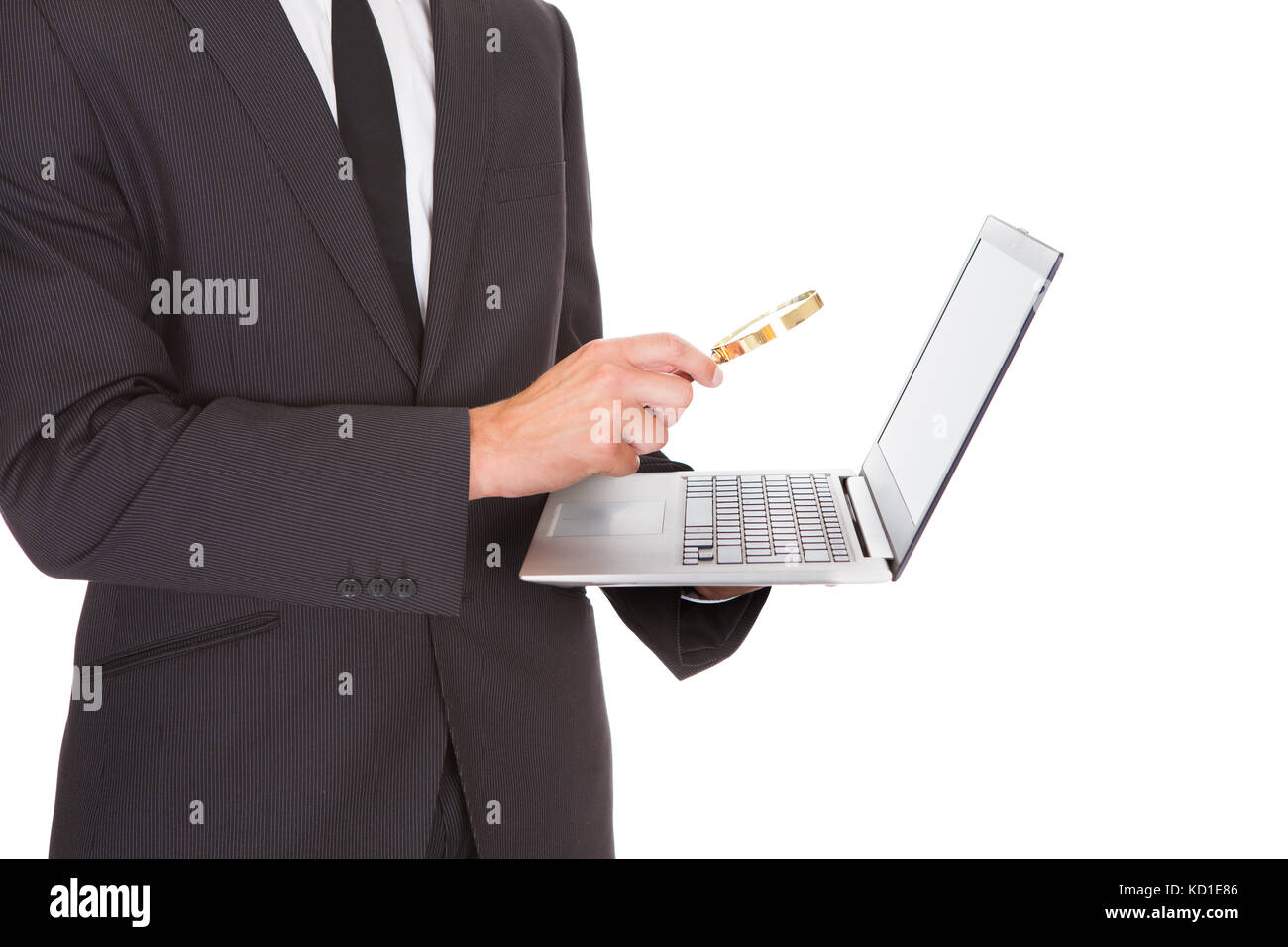 Close-up Of Businessman Looking At Laptop Through Magnifying Glass ...
