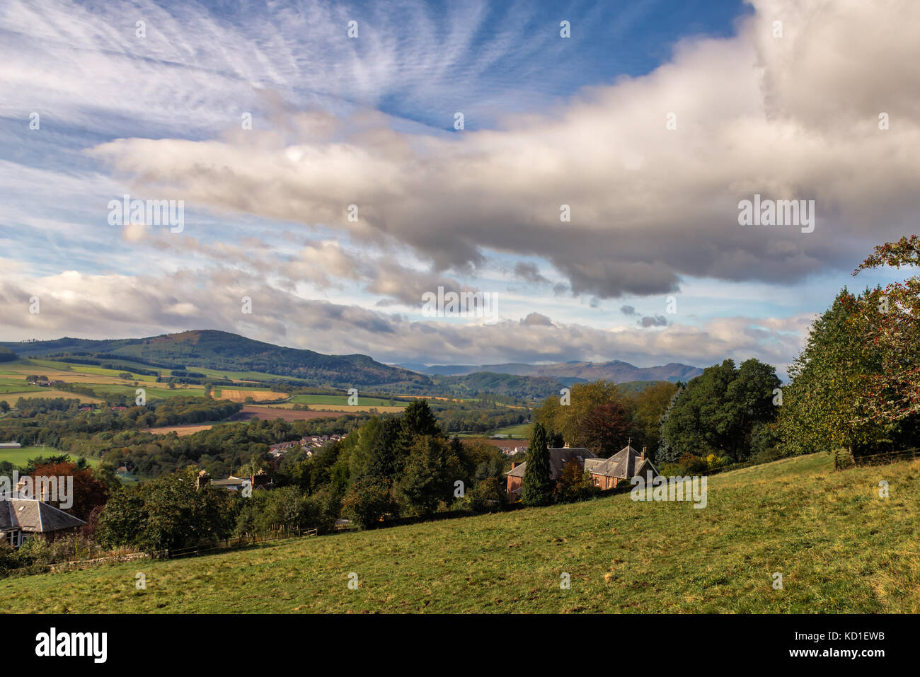 Scottish fields running in a slope down to the trees houses in Crieff ...