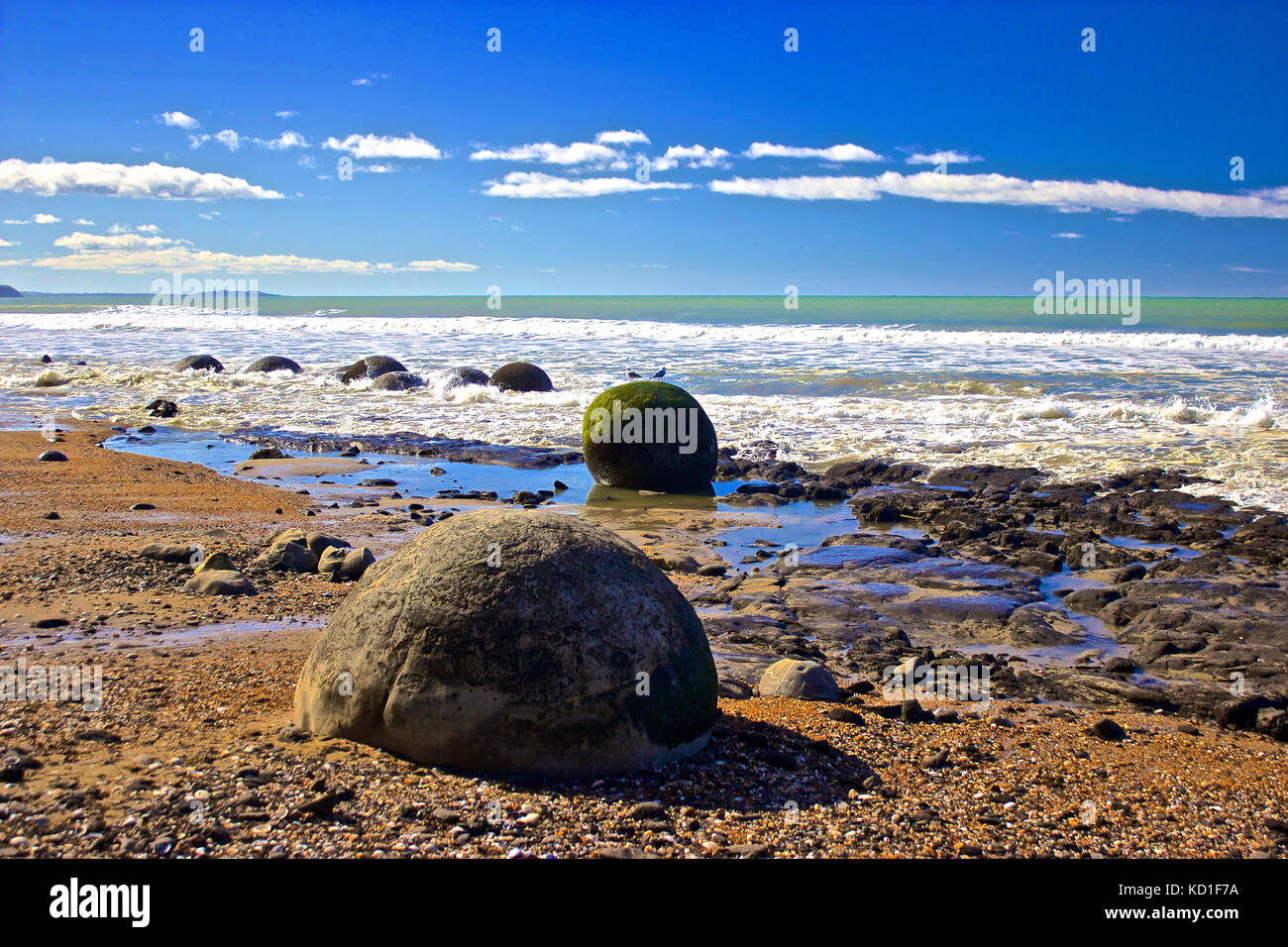 round rocks on the beach Stock Photo - Alamy