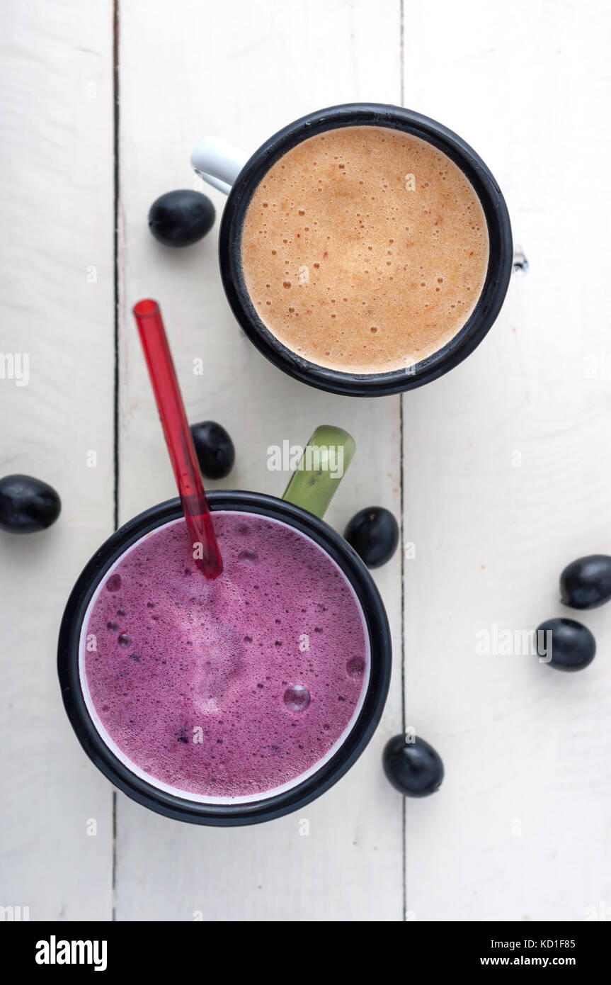 Colorful smoothies on wooden table, from above Stock Photo - Alamy