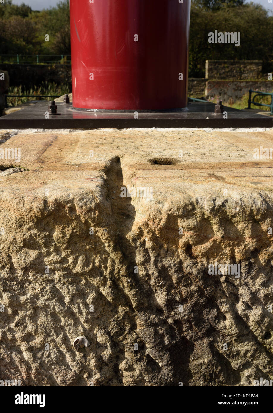 Steel plate at base of sculpture fixed to stone block with anchor ...
