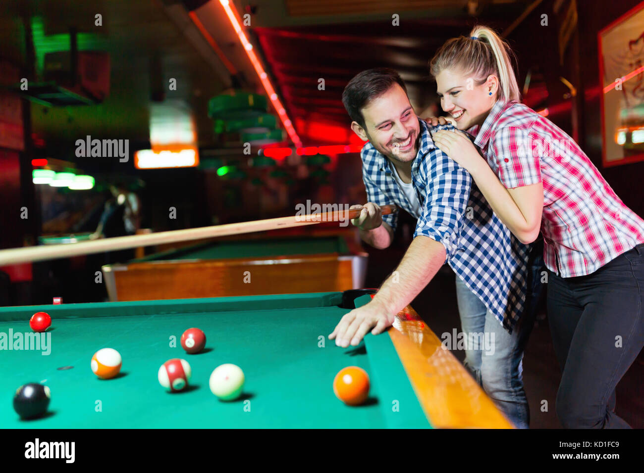 Two women shooting pool hi-res stock photography and images - Alamy