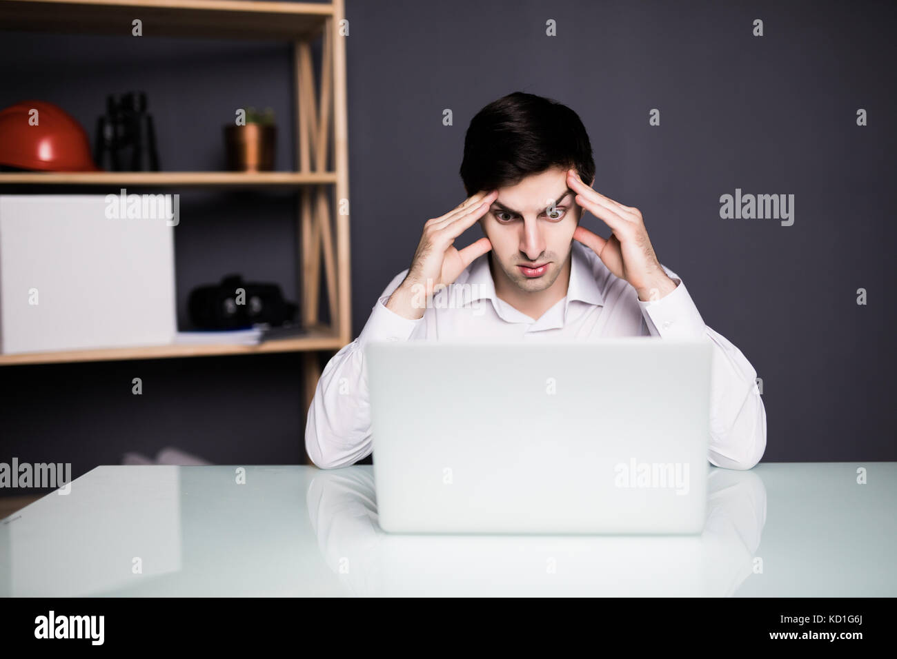 business man working problem using laptop looking at screen, hold head ...