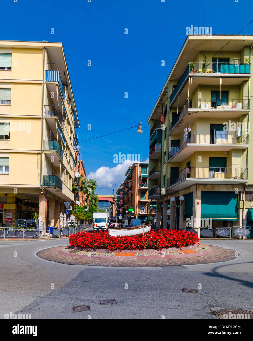 A decorative roundabout with fishing boat and flowers Recco Italy Stock ...